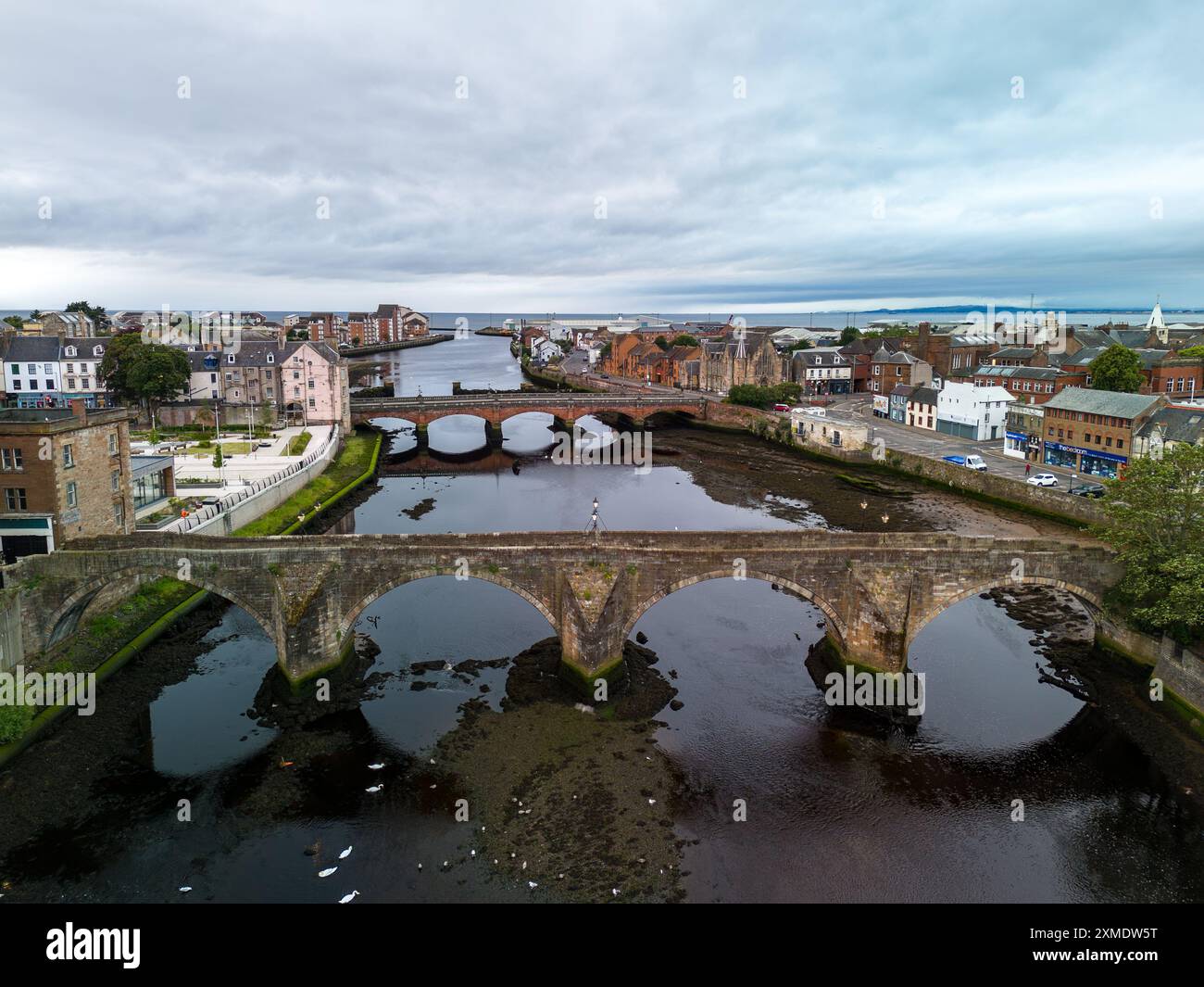 Aerial view of the river ayr flowing through the town of ayr with the ...