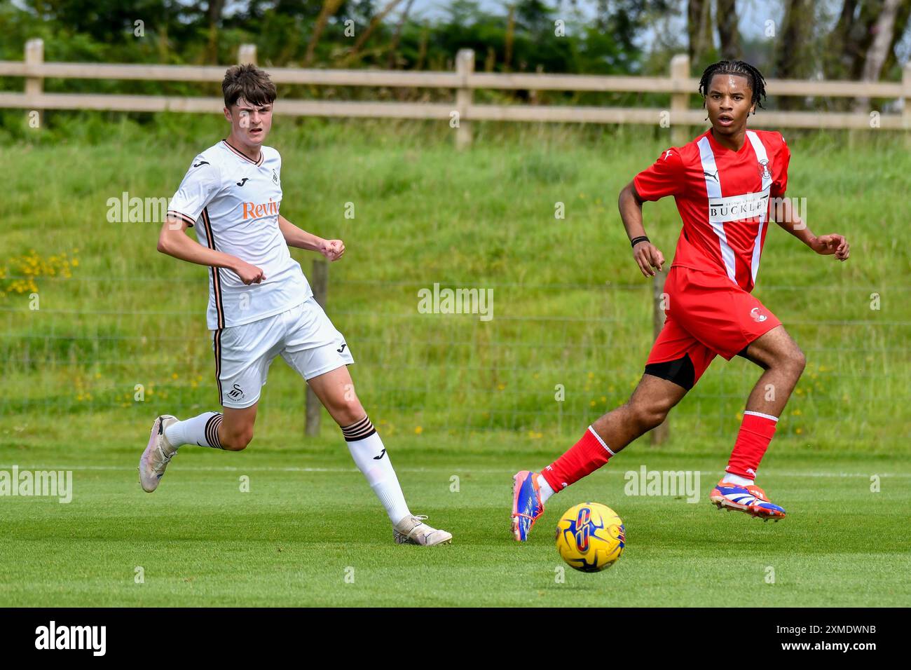 Swansea, Wales. 27 July 2024. Harvey Gray of Swansea City vies for ...