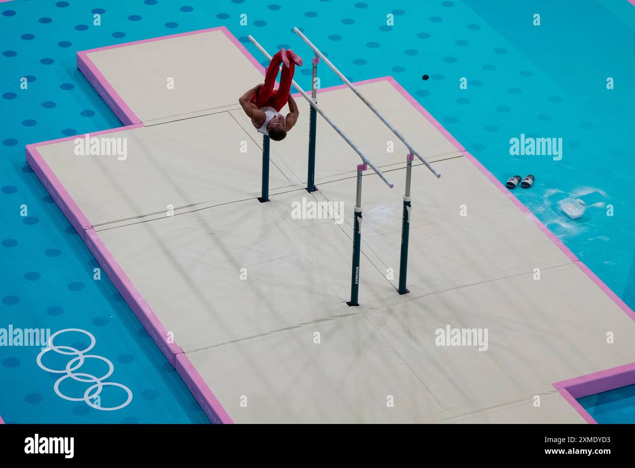 Kevin Penev of Bulgaria performs on the parallel bars during a men's ...