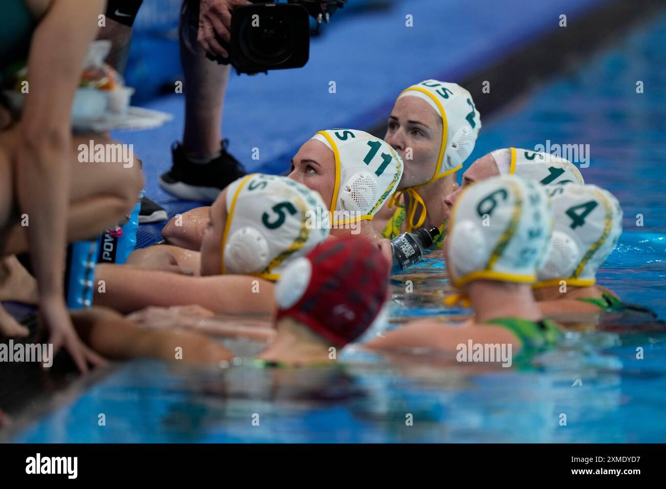 Australia's Tilly Kearns, center, and other players listen to head ...