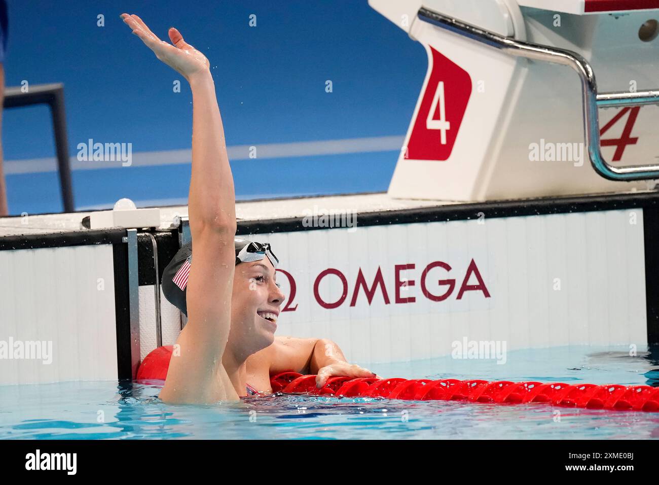 Gretchen Walsh, of the United States, waves after her race in the women ...