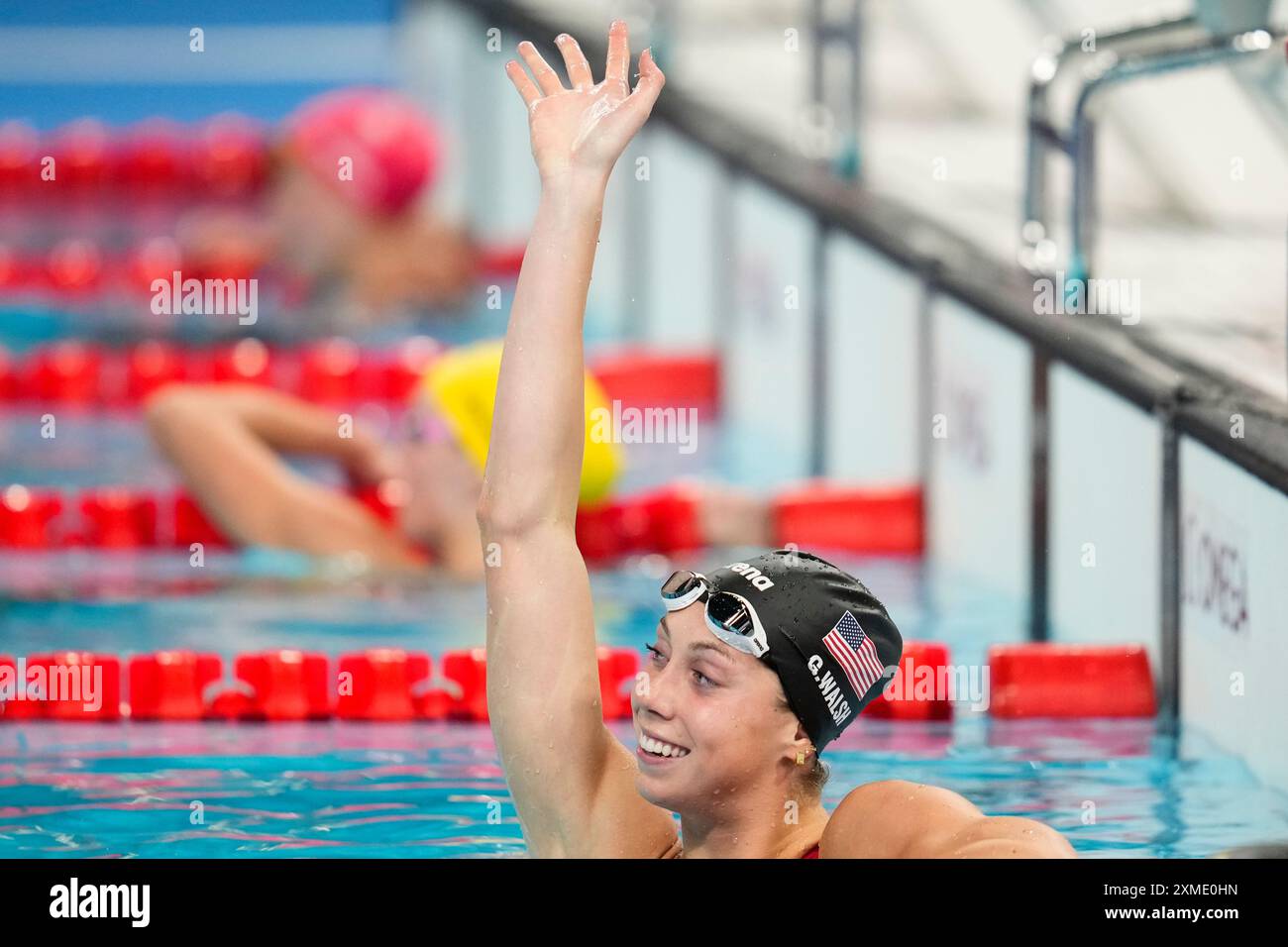 Gretchen Walsh, of the United States, celebrates after winning in the ...