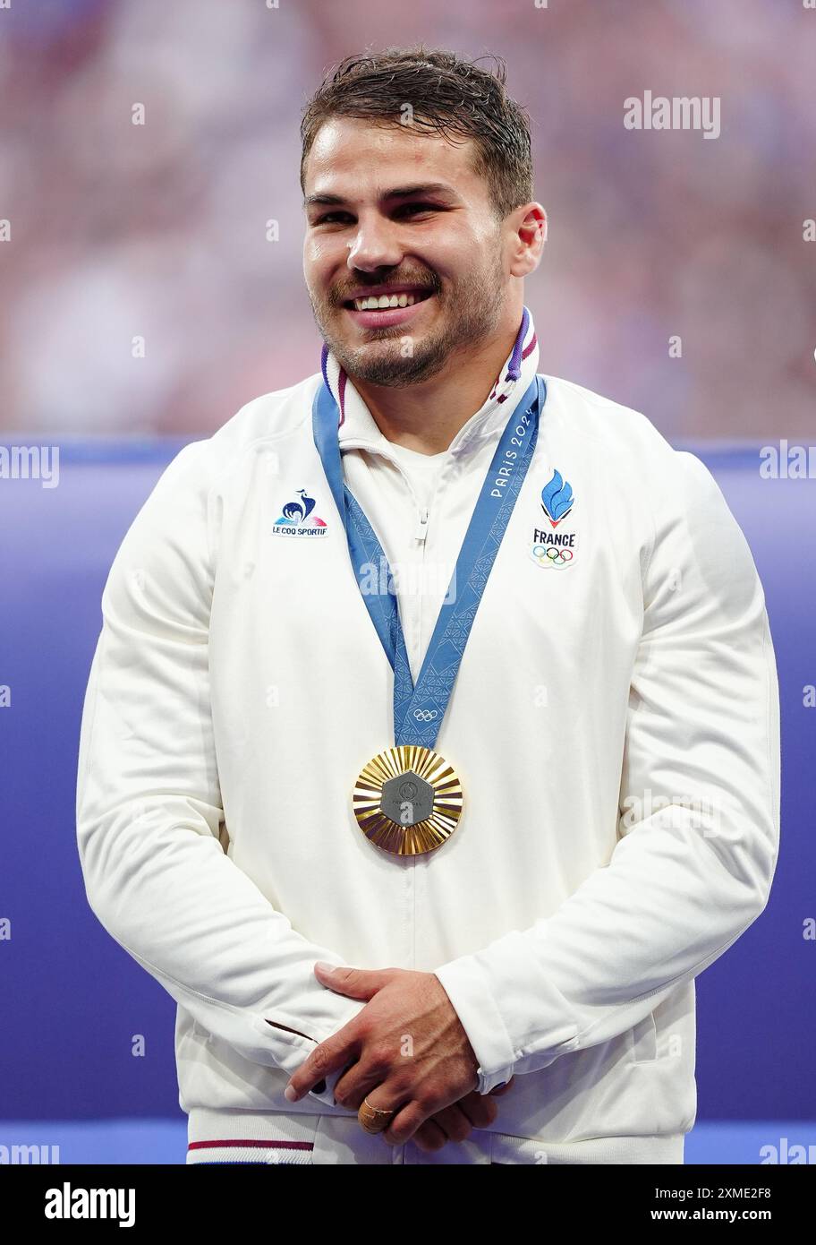 France's Antoine Dupont celebrates winning gold after the rugby sevens ...
