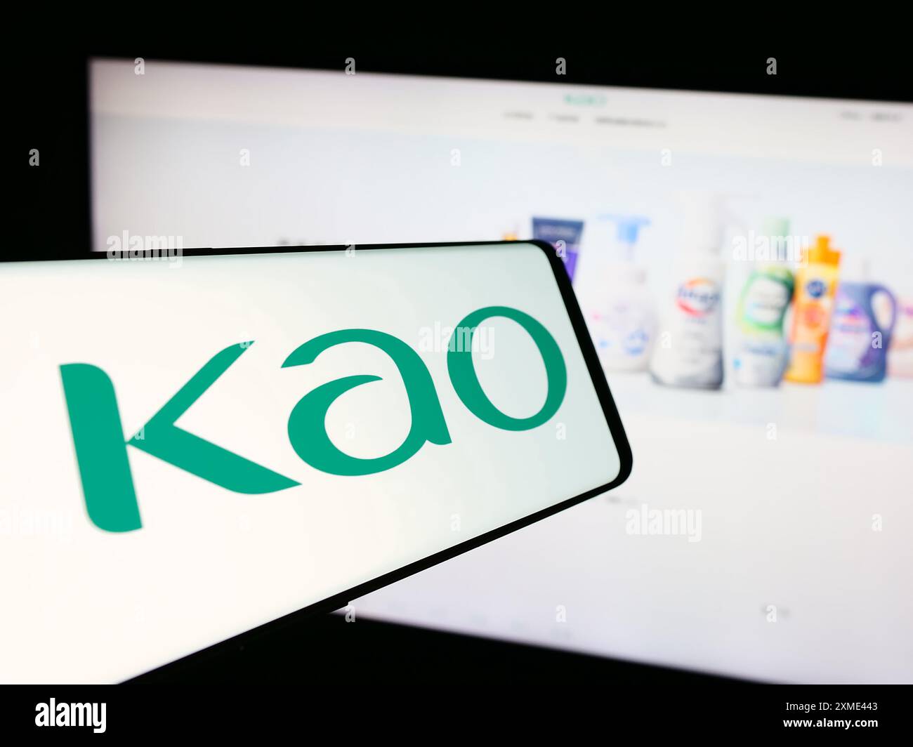 Mobile phone with logo of Japanese chemical company Kao Corporation in ...