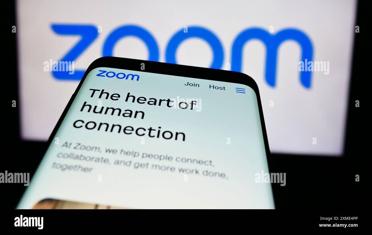 Mobile phone with webpage of US communications company Zoom Video ...