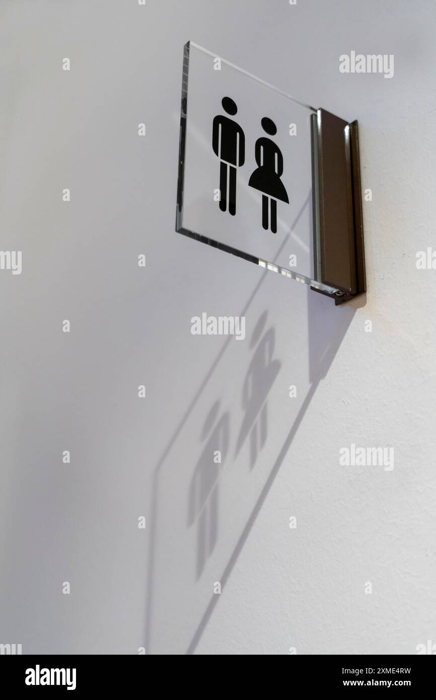 Transparent sign, indication of toilets, WC, with shade Stock Photo - Alamy