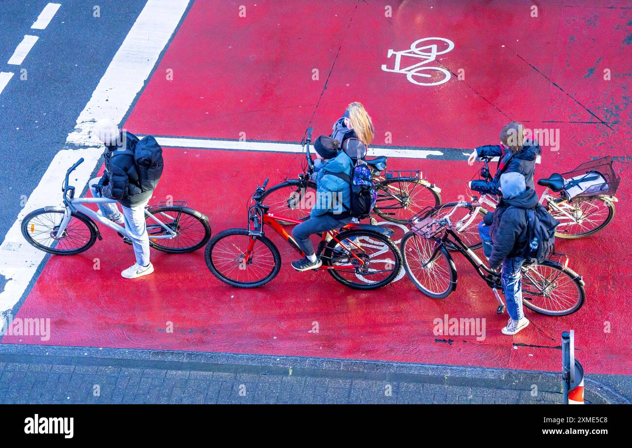 Cycle lane, space for cyclists at a traffic light crossing, marked red ...