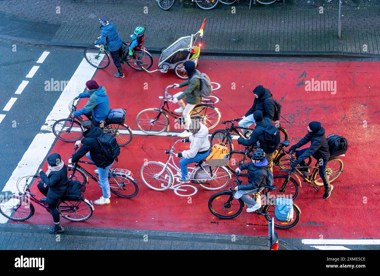 Cycle lane, space for cyclists at a traffic light crossing, marked red ...