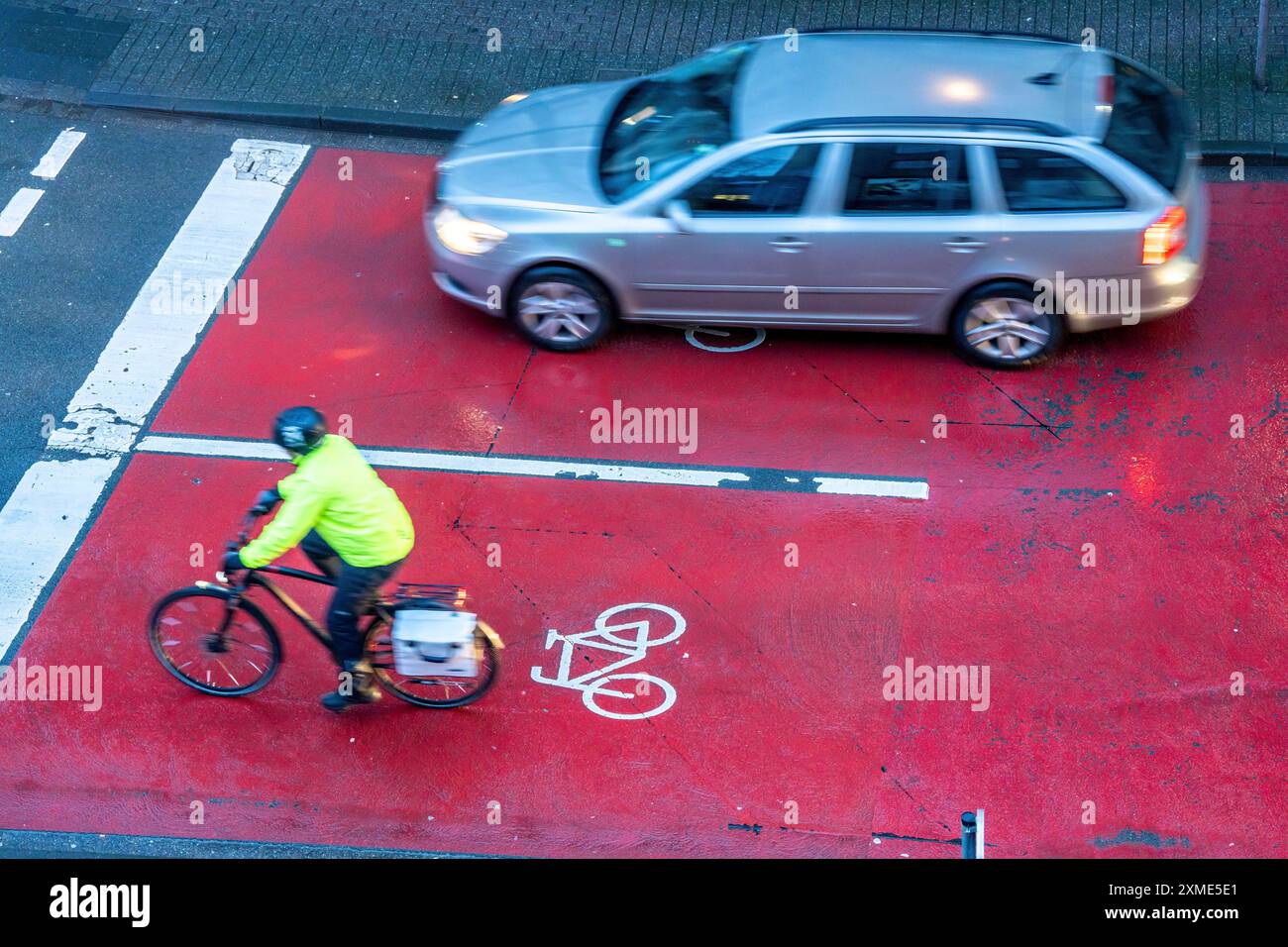 Cycle lane, space for cyclists at a traffic light crossing, marked red ...