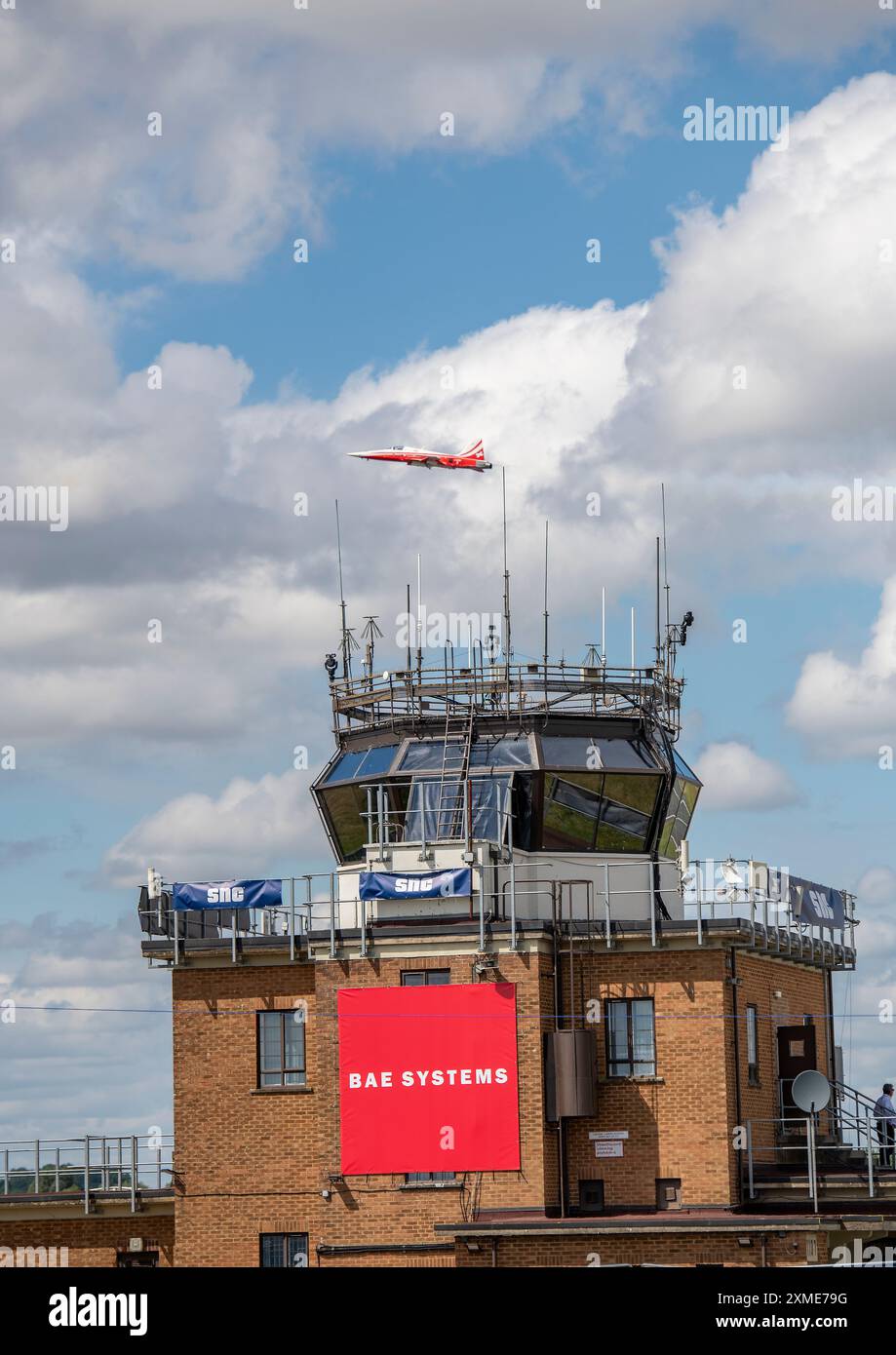 jet aircraft flying over the air traffic control tower at raf fairford ...