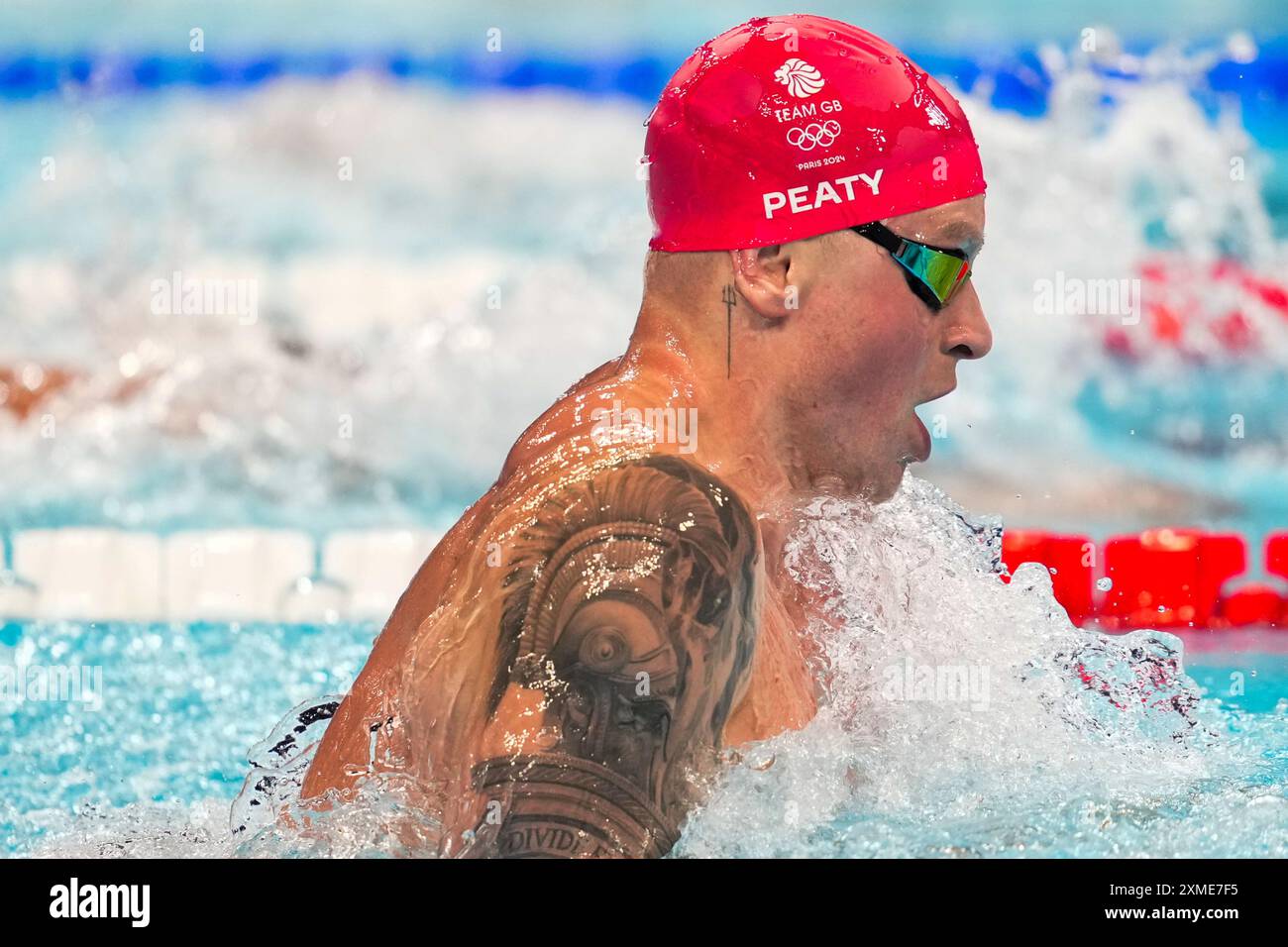 Adam Peaty, of Britain, competes in the men's 100-meter breaststroke ...