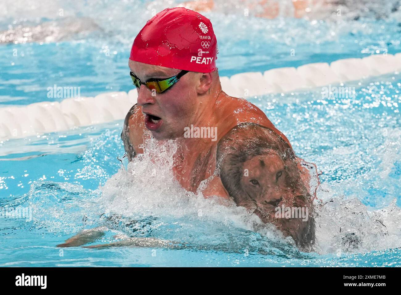 Adam Peaty, of Britain, competes in the men's 100-meter breaststroke ...