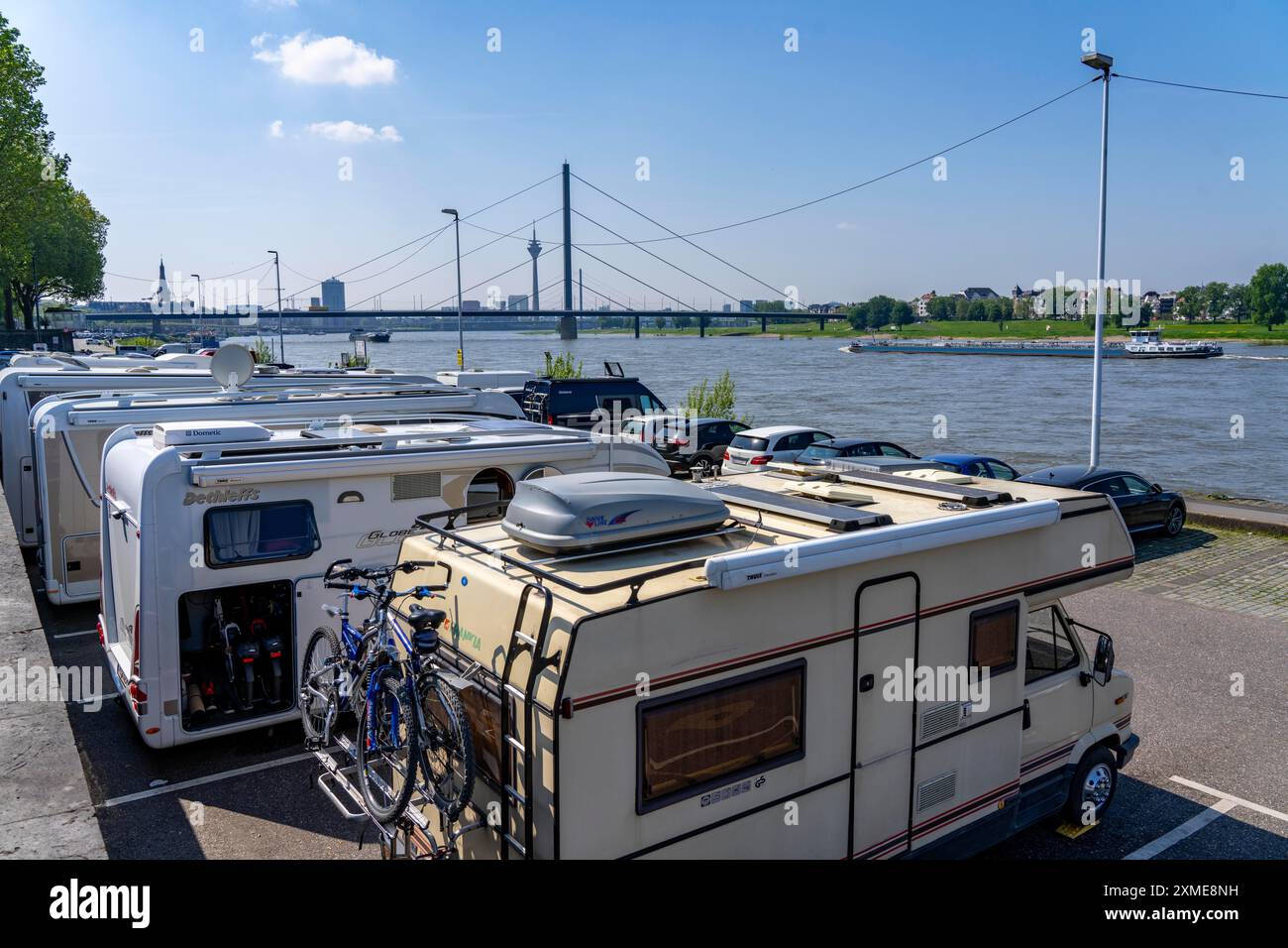 Motorhome parking space on the banks of the Rhine, Duesseldorf skyline ...