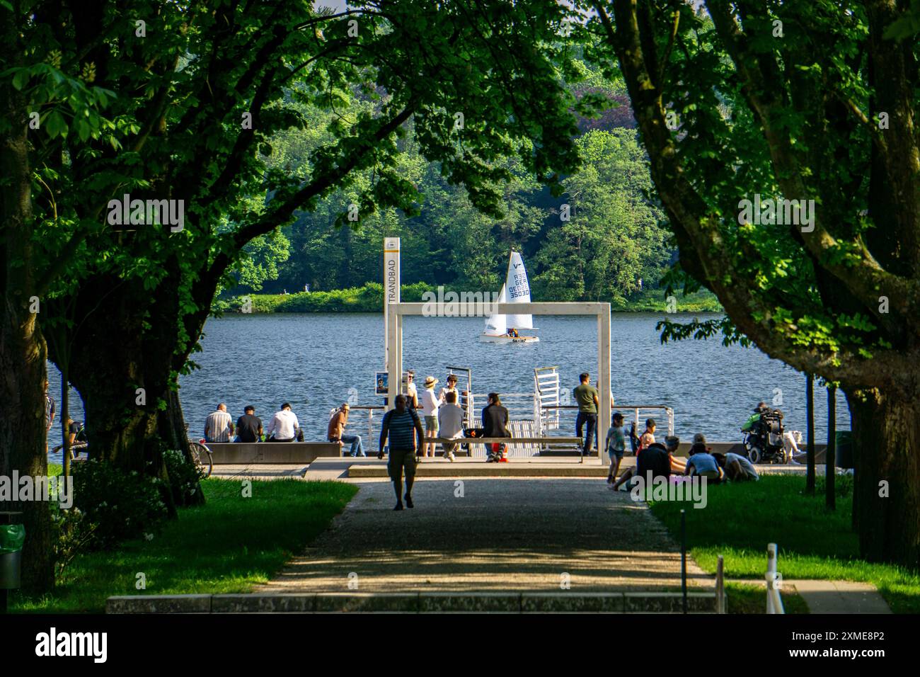 Lake Baldeney in Essen, tree-lined avenue at Seaside Beach, jetty of ...