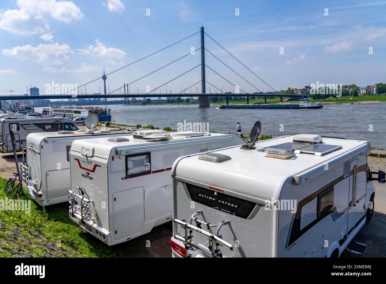 Motorhome parking space on the banks of the Rhine, Duesseldorf skyline ...