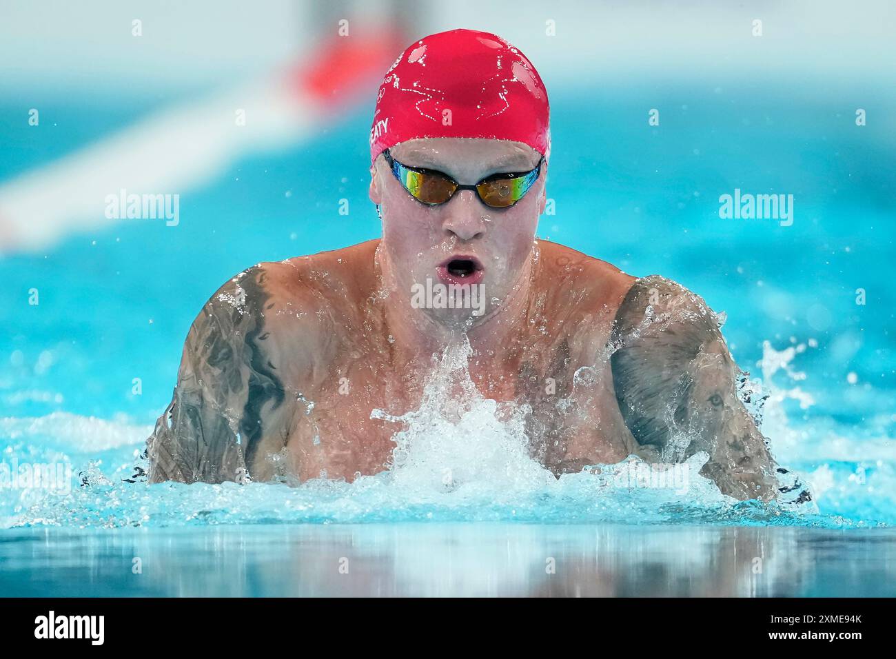 Adam Peaty, of Britain, competes in the men's 100-meter breaststroke ...