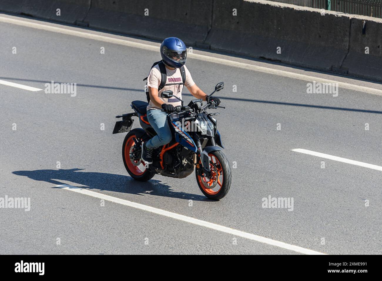 ISTANBUL, TURKEY - JULY 27, 2024: Man from city riding motorcycle on ...