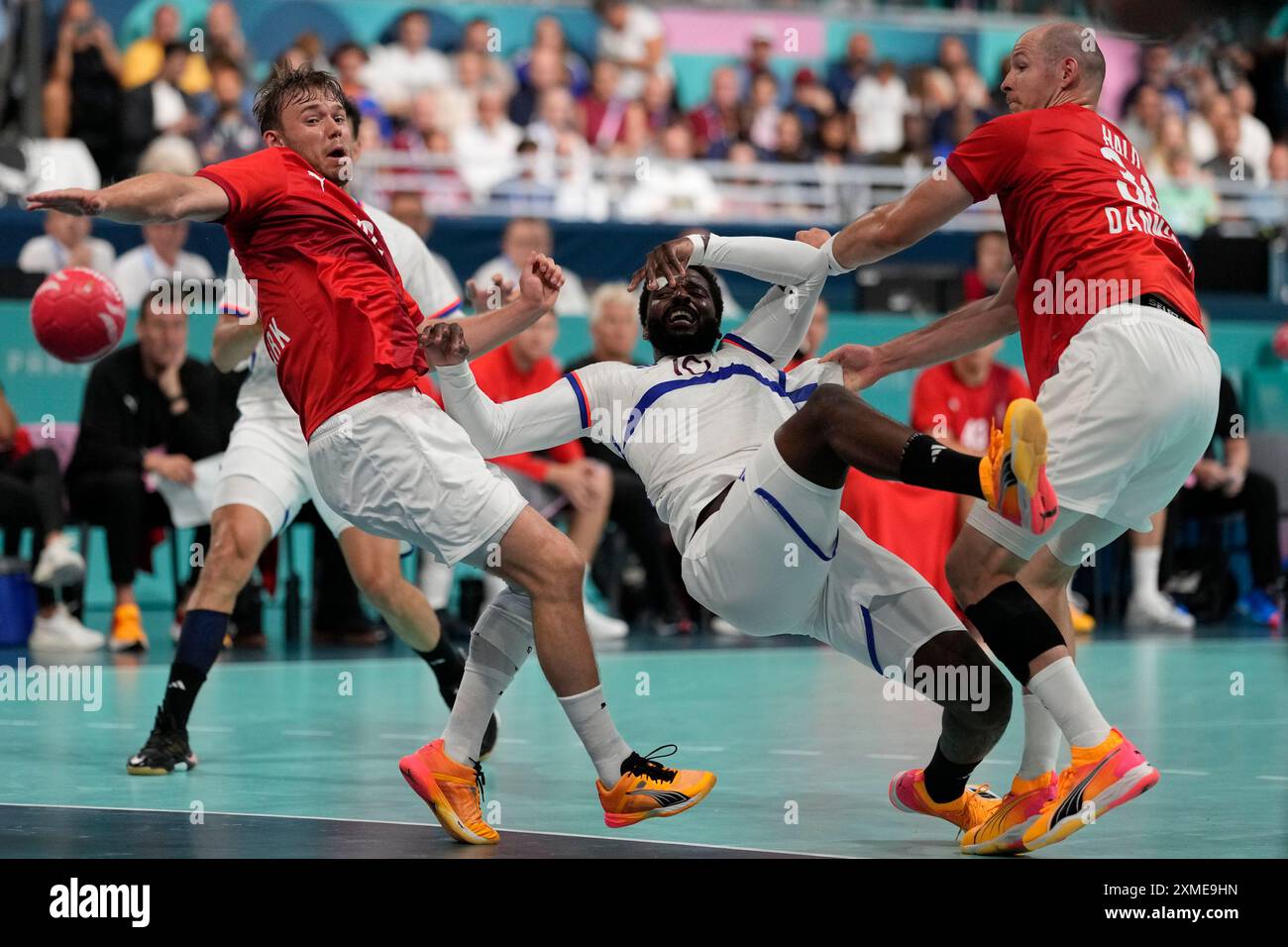 Dika Mem, center, of France, looses ball possession during their game ...