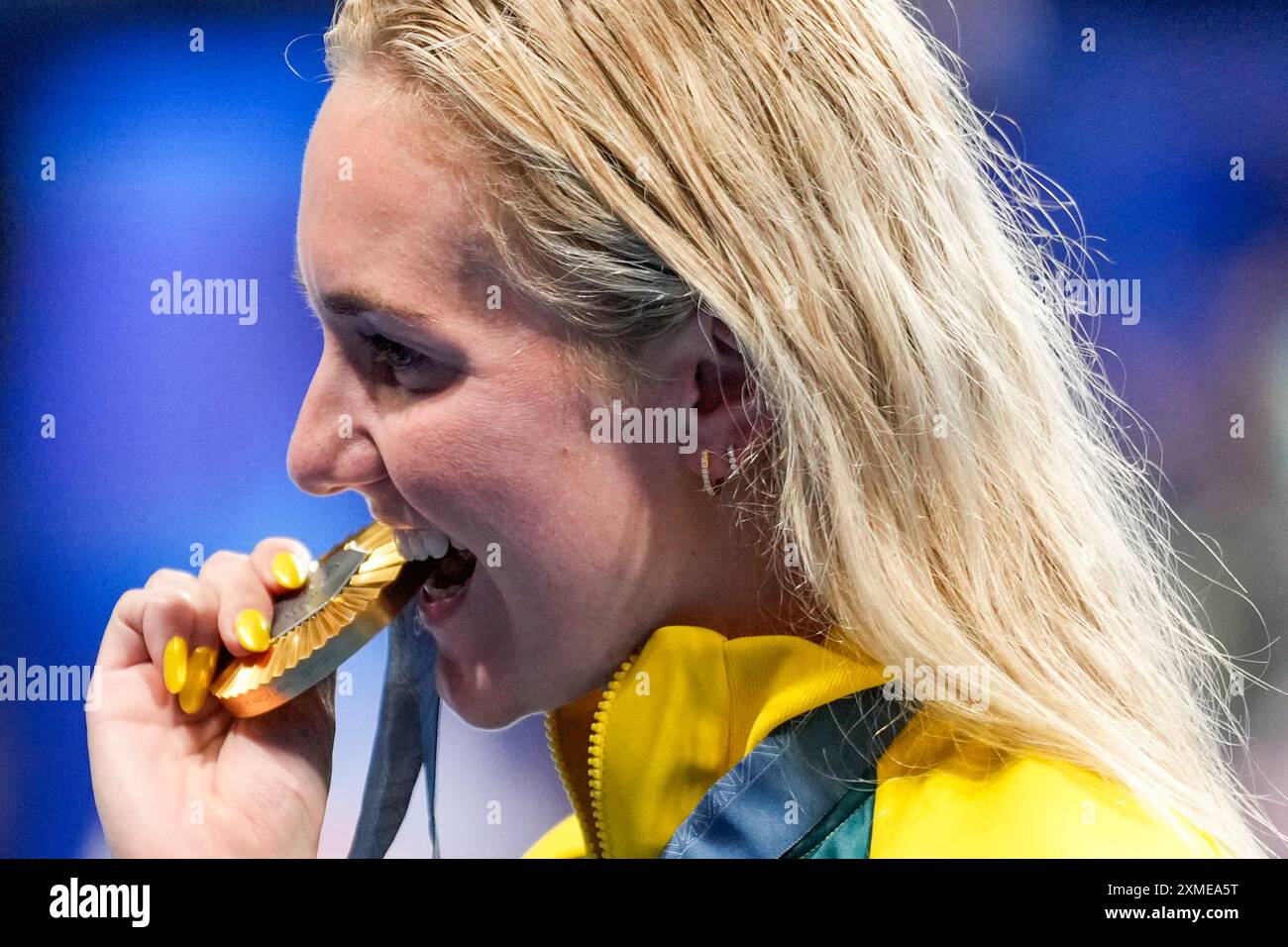 Gold medalist, Ariarne Titmus, of Australia, poses for the media after ...