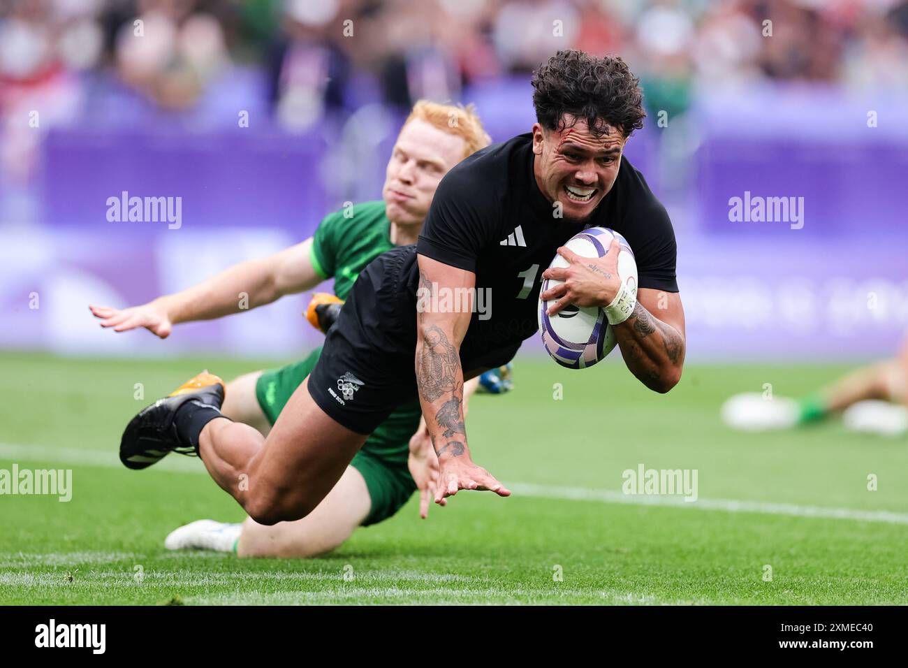 Paris, France, 27 July, 2024. Moses Leo (11) of Team New Zealand runs ...