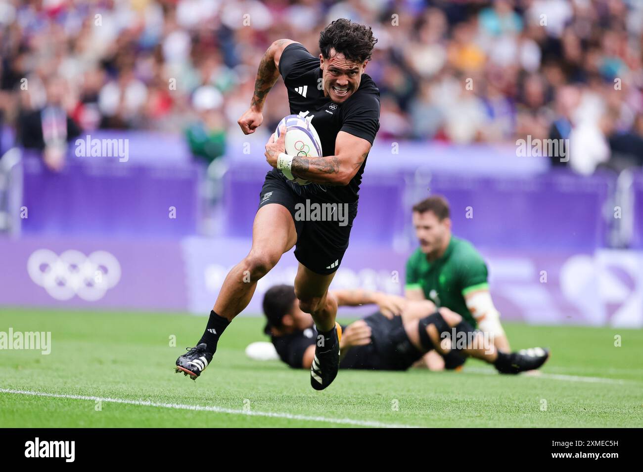 Paris, France, 27 July, 2024. Moses Leo (11) of Team New Zealand runs ...