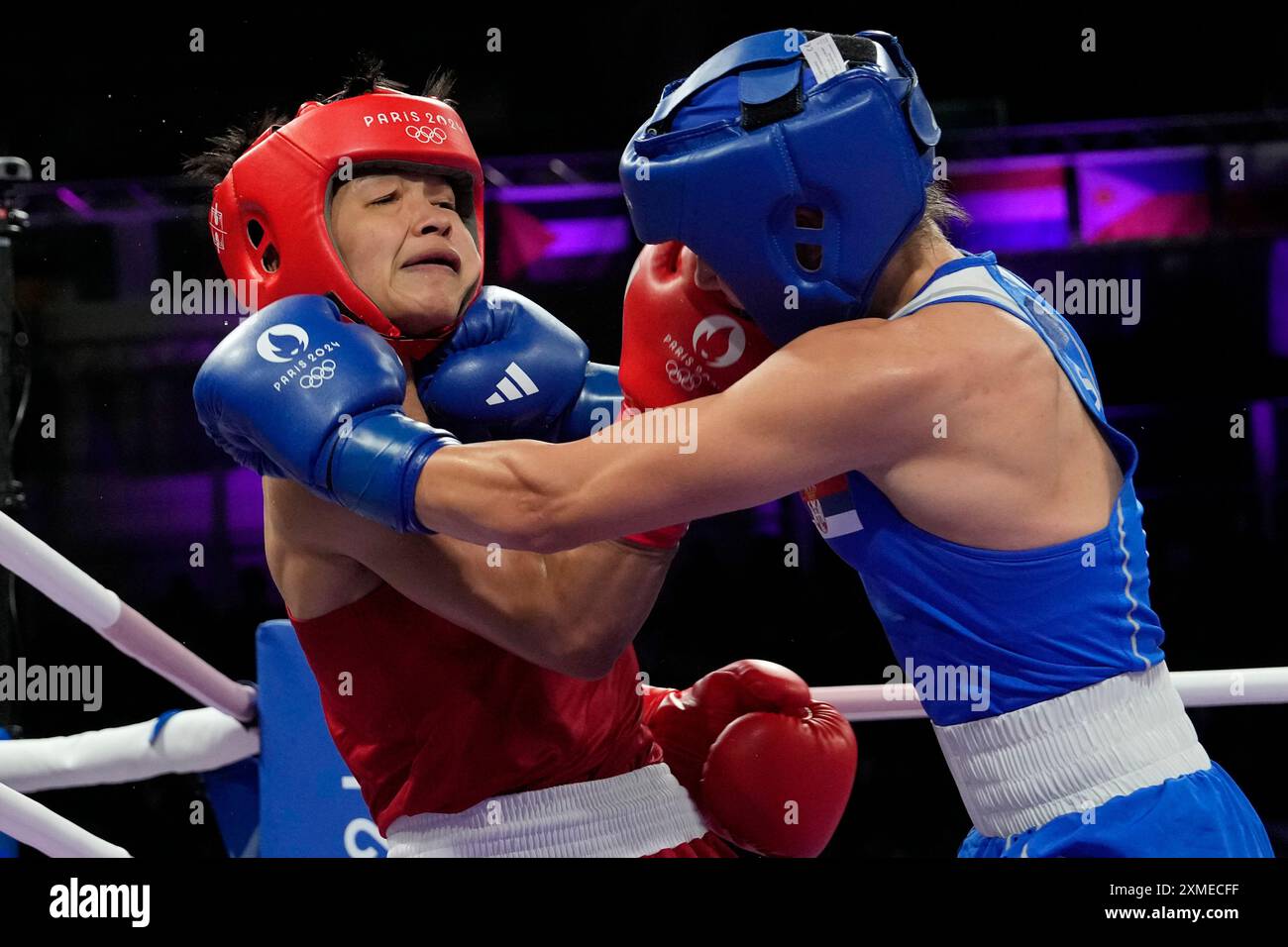 Thailand's Jutamas Jitpong, left, exchanges punches with Serbia's Sara Cirkovic in their women's ...