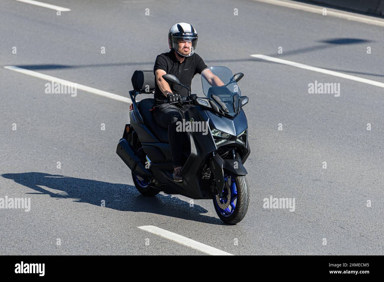 ISTANBUL, TURKEY - JULY 27, 2024: Man from city riding motorcycle on ...