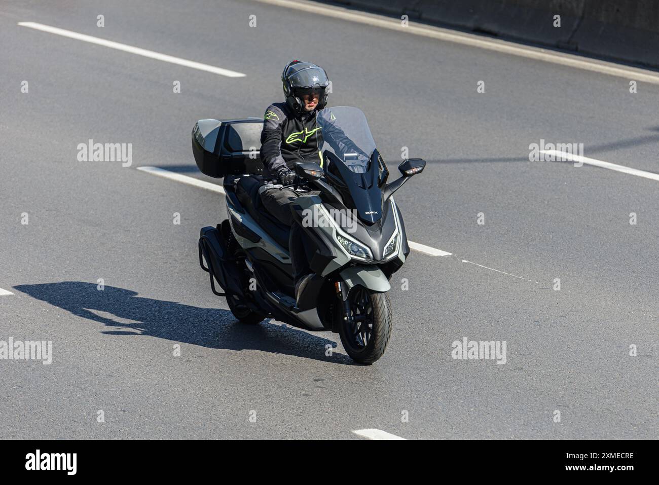 ISTANBUL, TURKEY - JULY 27, 2024: Man from city riding motorcycle on ...