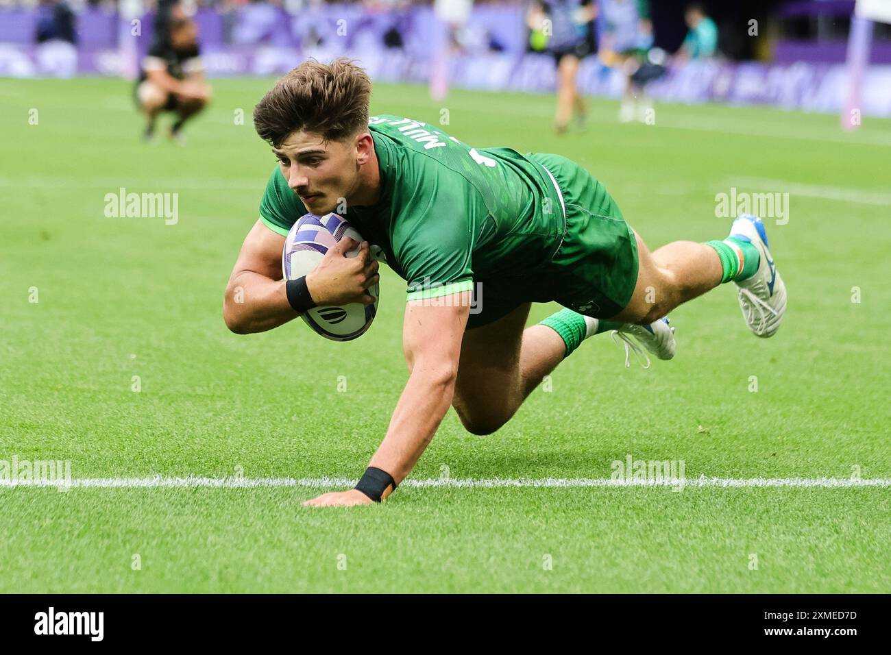 PARIS, FRANCE - JULY 27: Chay Mullins (6) of Team Ireland dives in for ...