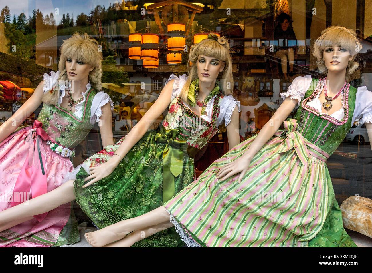 Shop window of fashion shop for traditional costumes, female mannequins ...