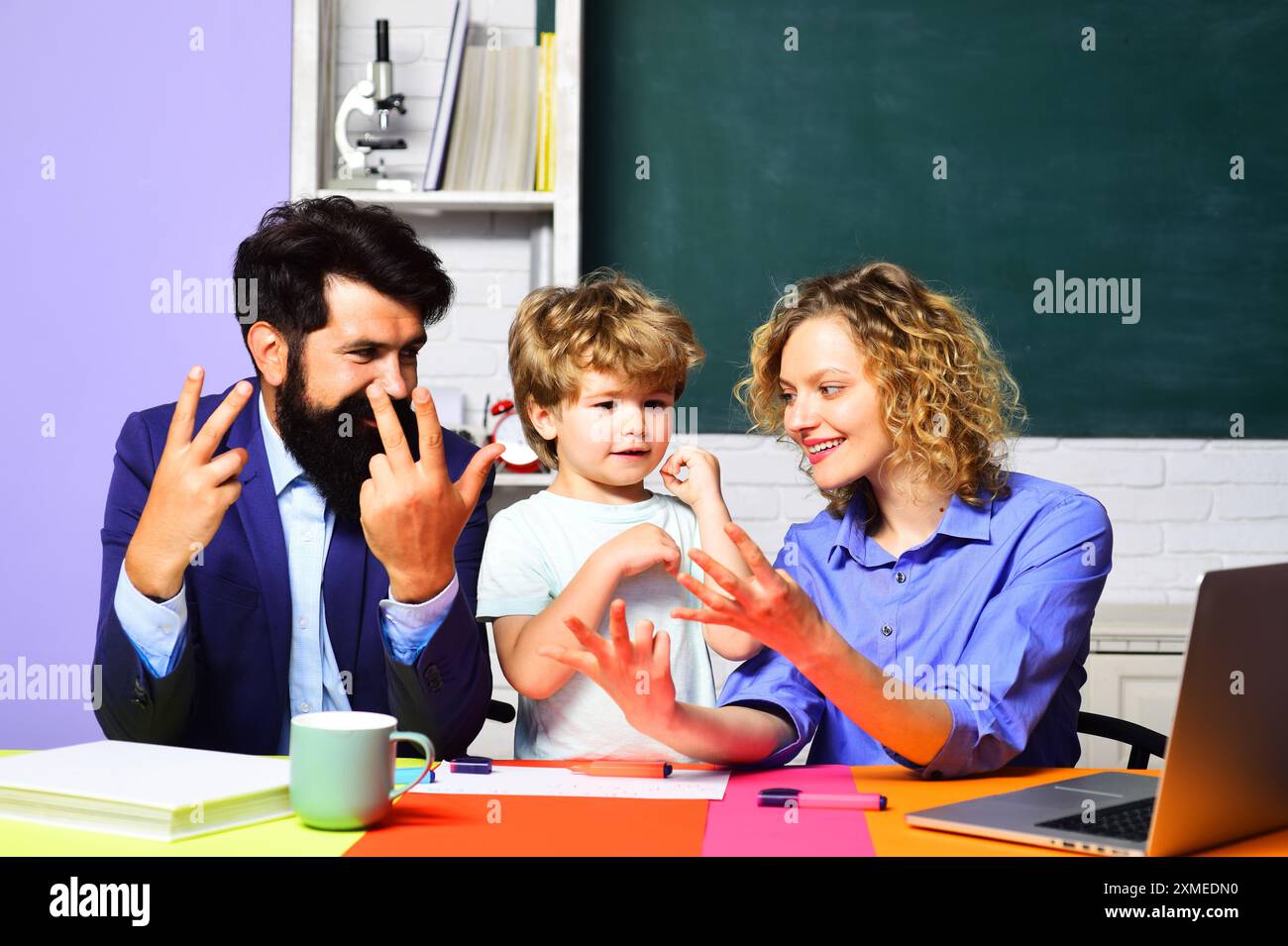 Mathematics for children. Schoolboy pupil do math homework with tutors ...