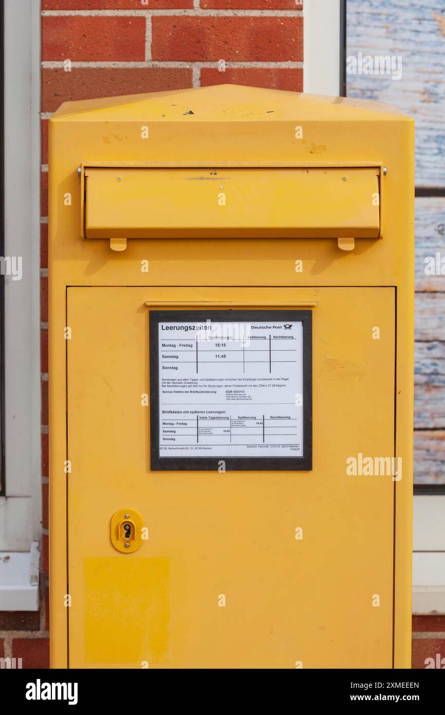 Yellow letterbox from Deutsche Post, Germany Stock Photo - Alamy