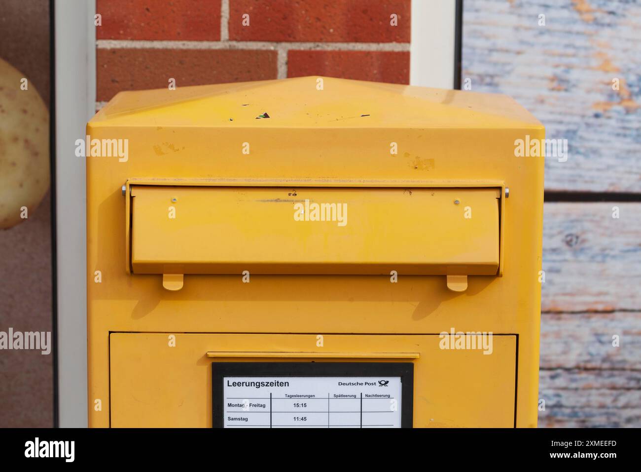 Yellow letterbox from Deutsche Post, Germany Stock Photo - Alamy
