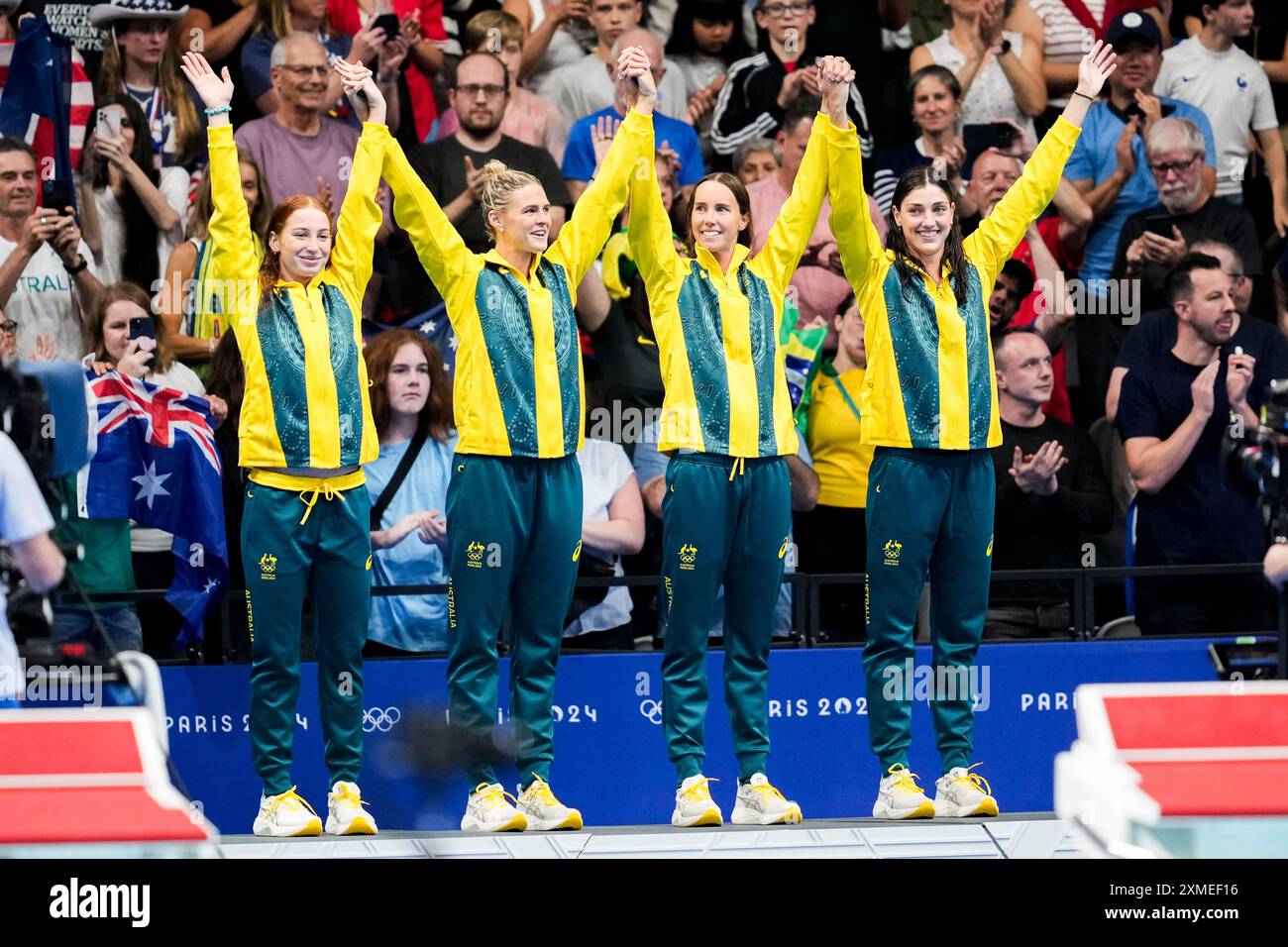 Gold medalist, team Australia celebrate on the podium after winning the women's 4x100-meter ...