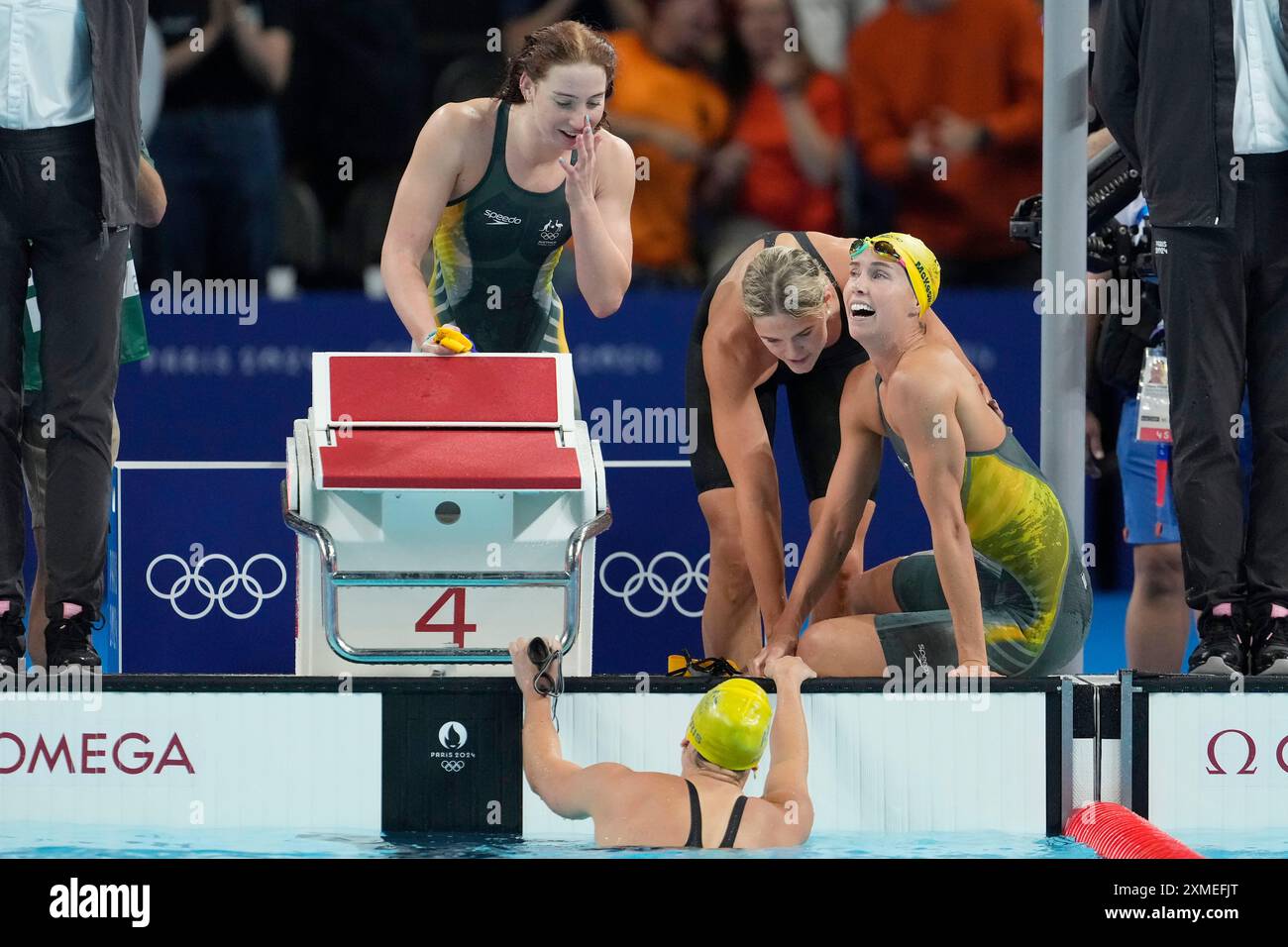 Swimmers from Australia celebrate after winning the women's 4x100-meter freestyle relay final at ...