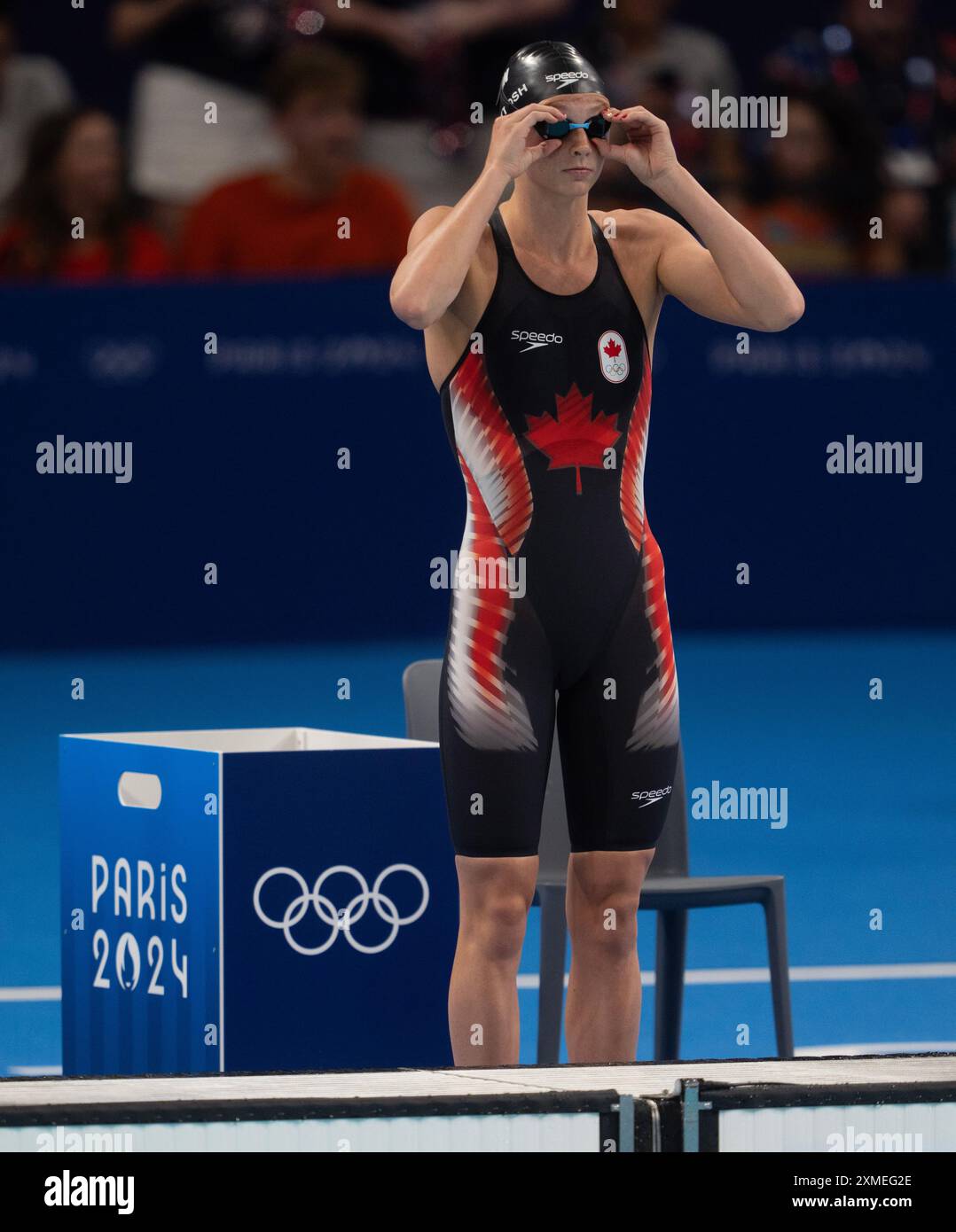 Swimmer Summer McIntosh, from Toronto, adjusts her goggles as she ...
