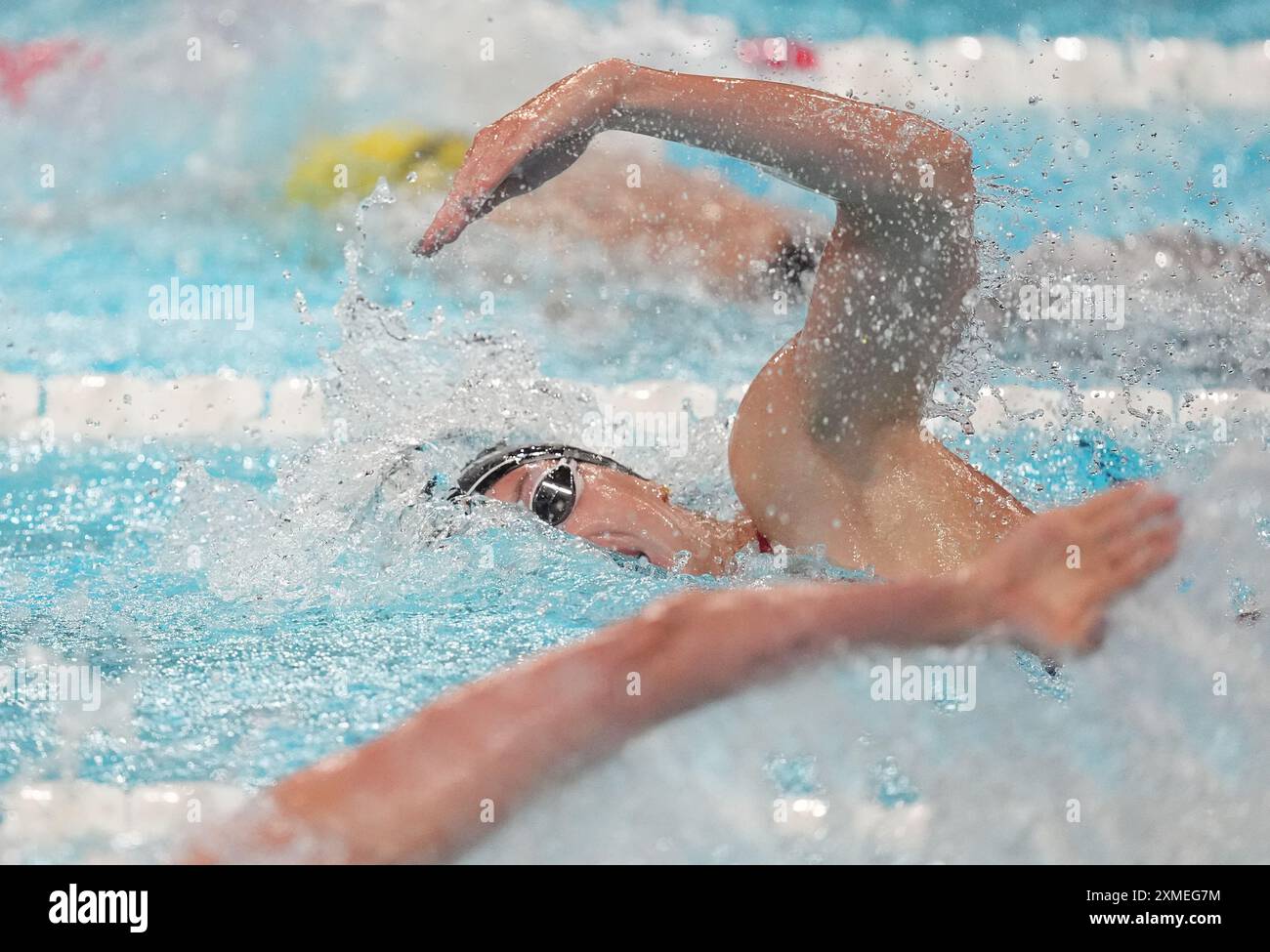 Paris, France. 27th July, 2024. A swimmer from Team USA tries to catch ...
