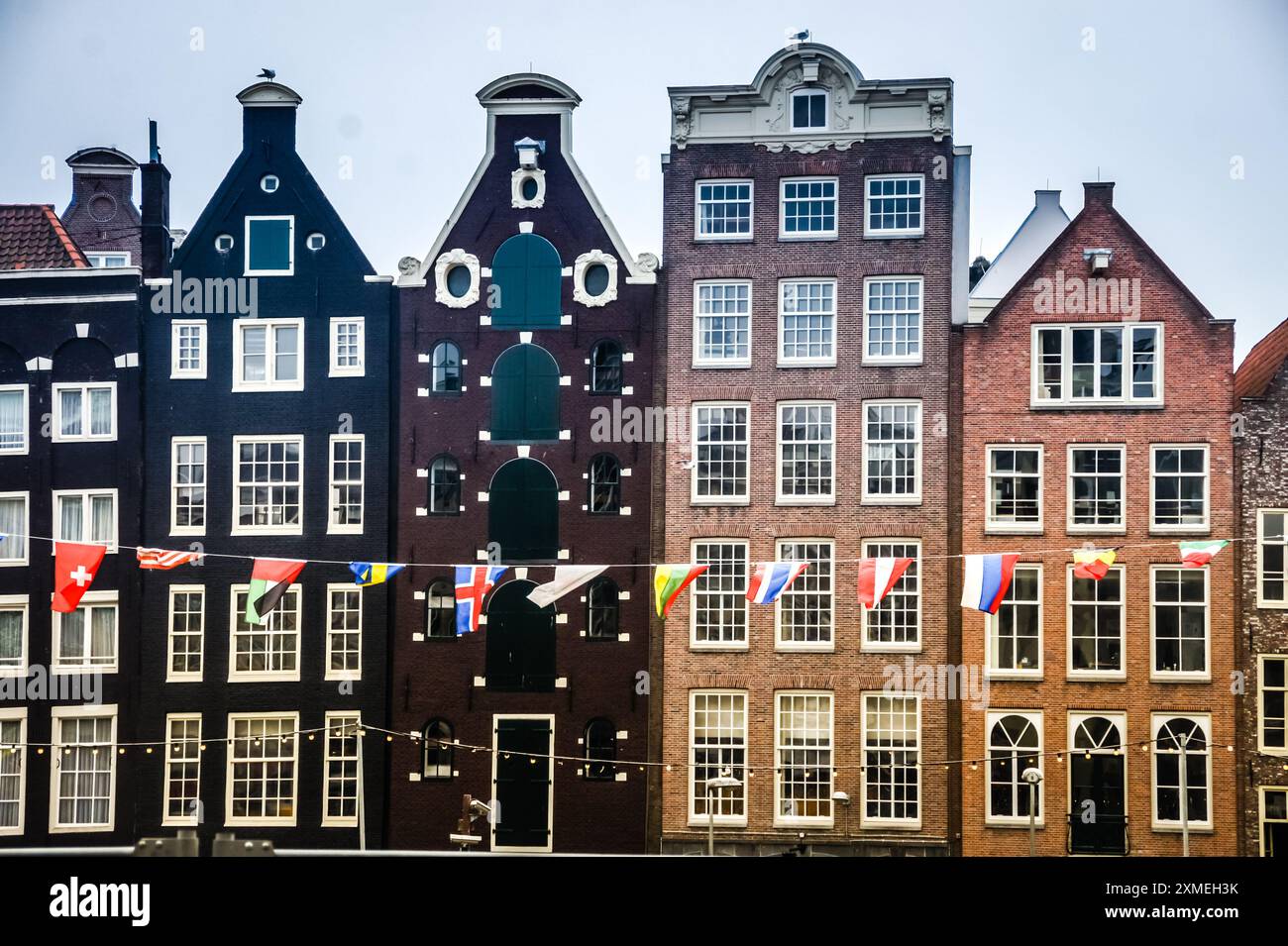 Amsterdam's iconic canal houses line the scenic waterways, their narrow ...