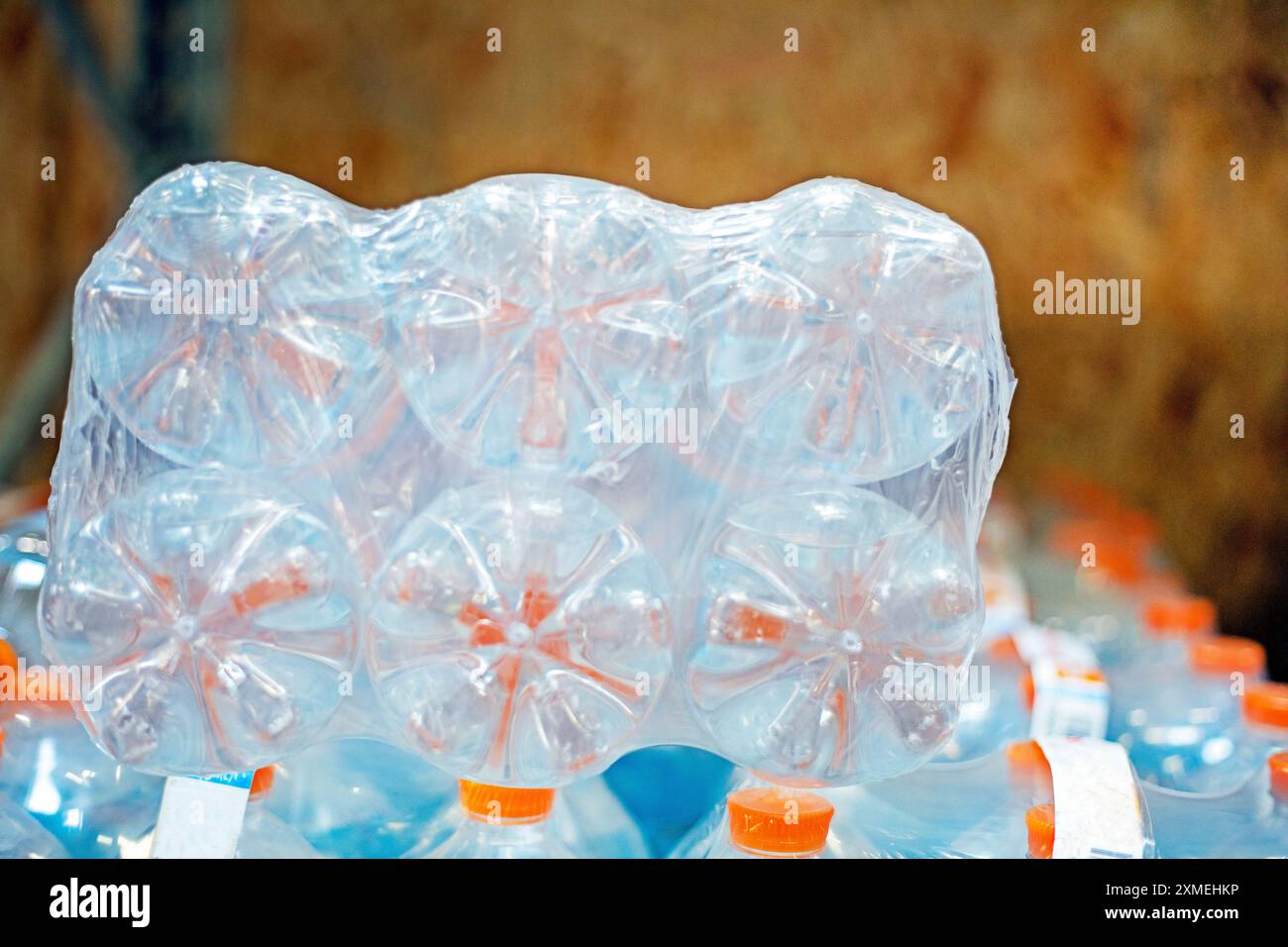 drinking water packaged in plastic containers on the shelves in the ...