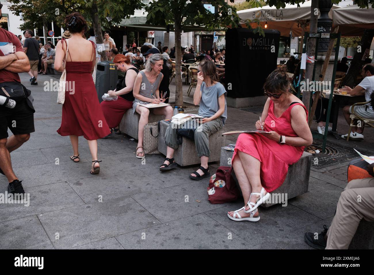 People paint during a speed painting contest in Plaza de Santa Ana to ...