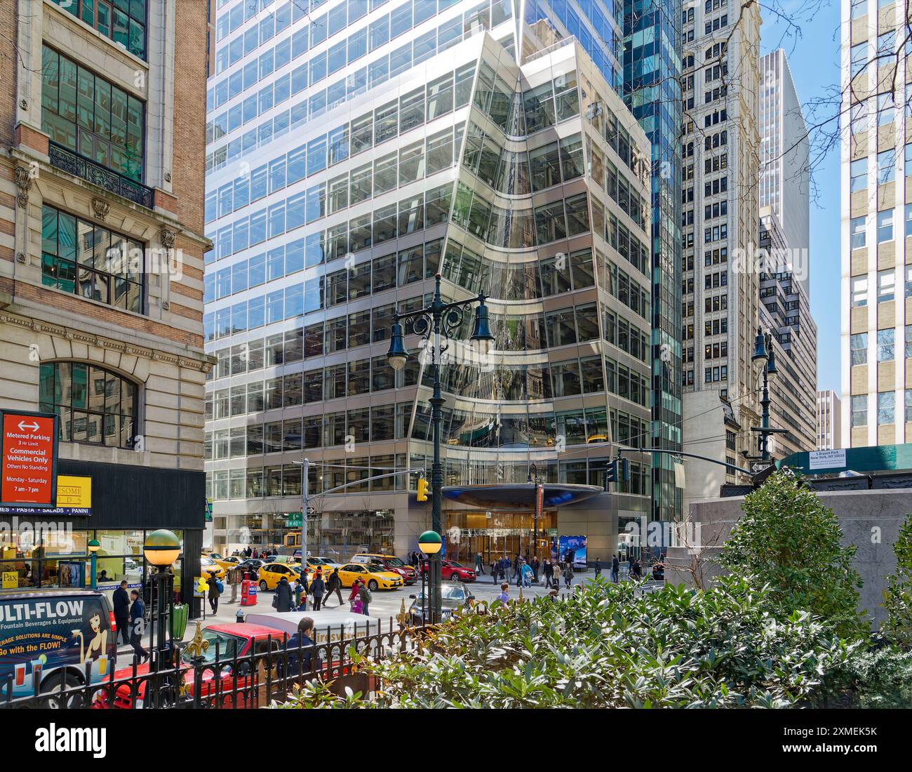 A cone is sculpted from the corner of 7 Bryant Park above the circular ...