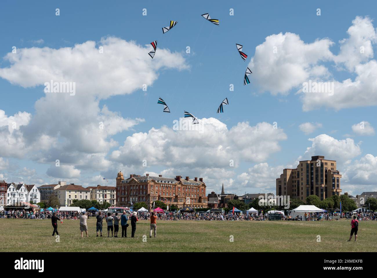 Kite festival on Southsea common in Portsmouth. Group of people flying ...