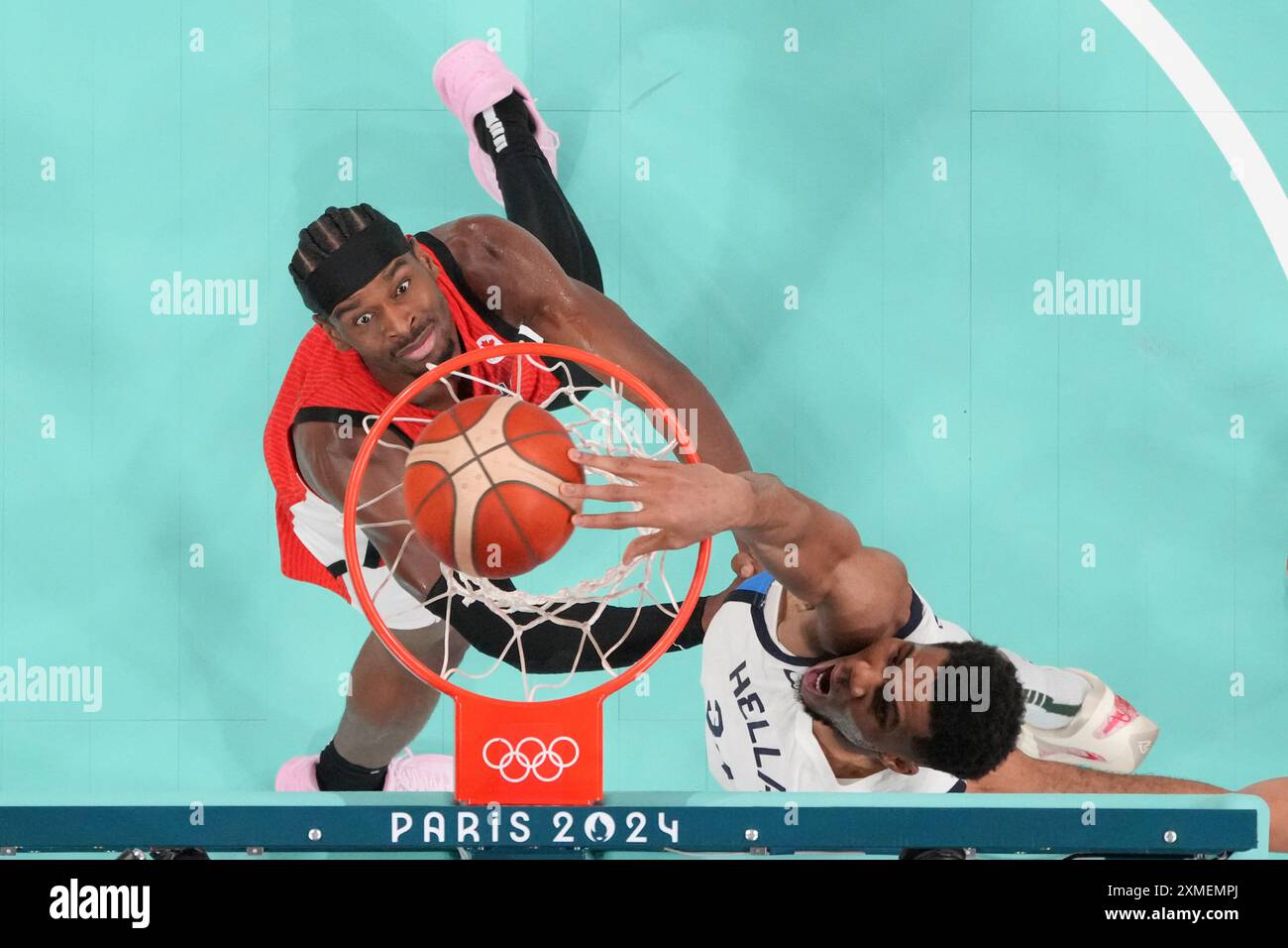 Giannis Antetokounmpo, of Greece, gets a dunk over Shai Gilgeous ...