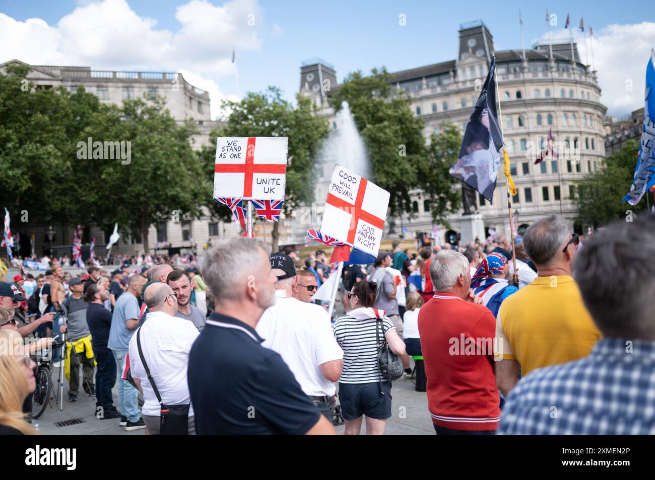 London, UK. 27th July, 2024. Demonstrators hold placards during the ...