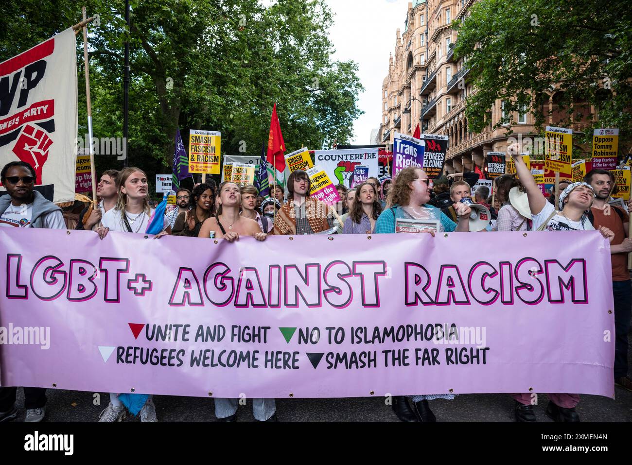 LGBT+ against Racism banner, Stand Up To Racism demonstrators march in ...