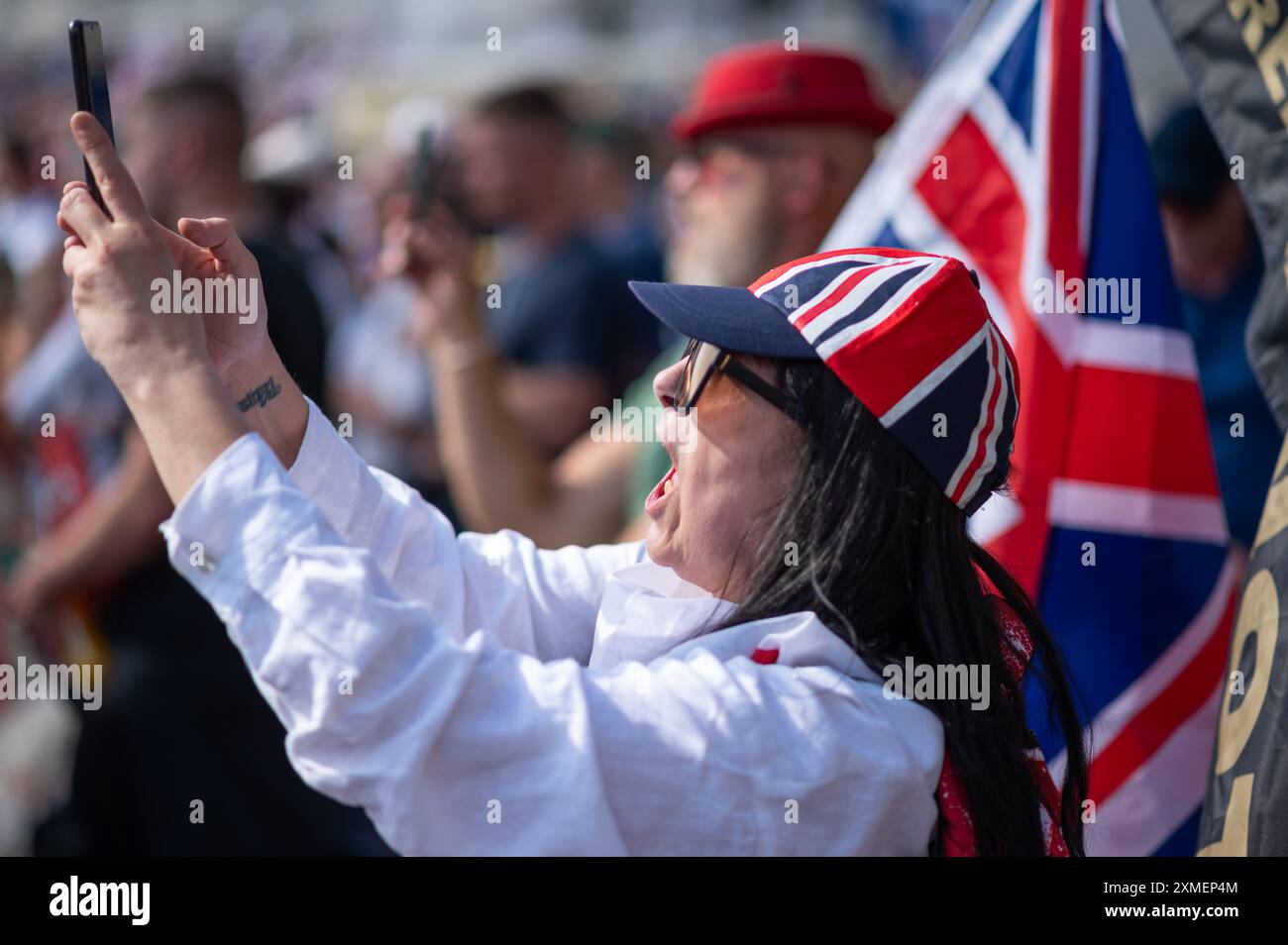 A demonstrator seen chanting and taking pictures during the rally ...