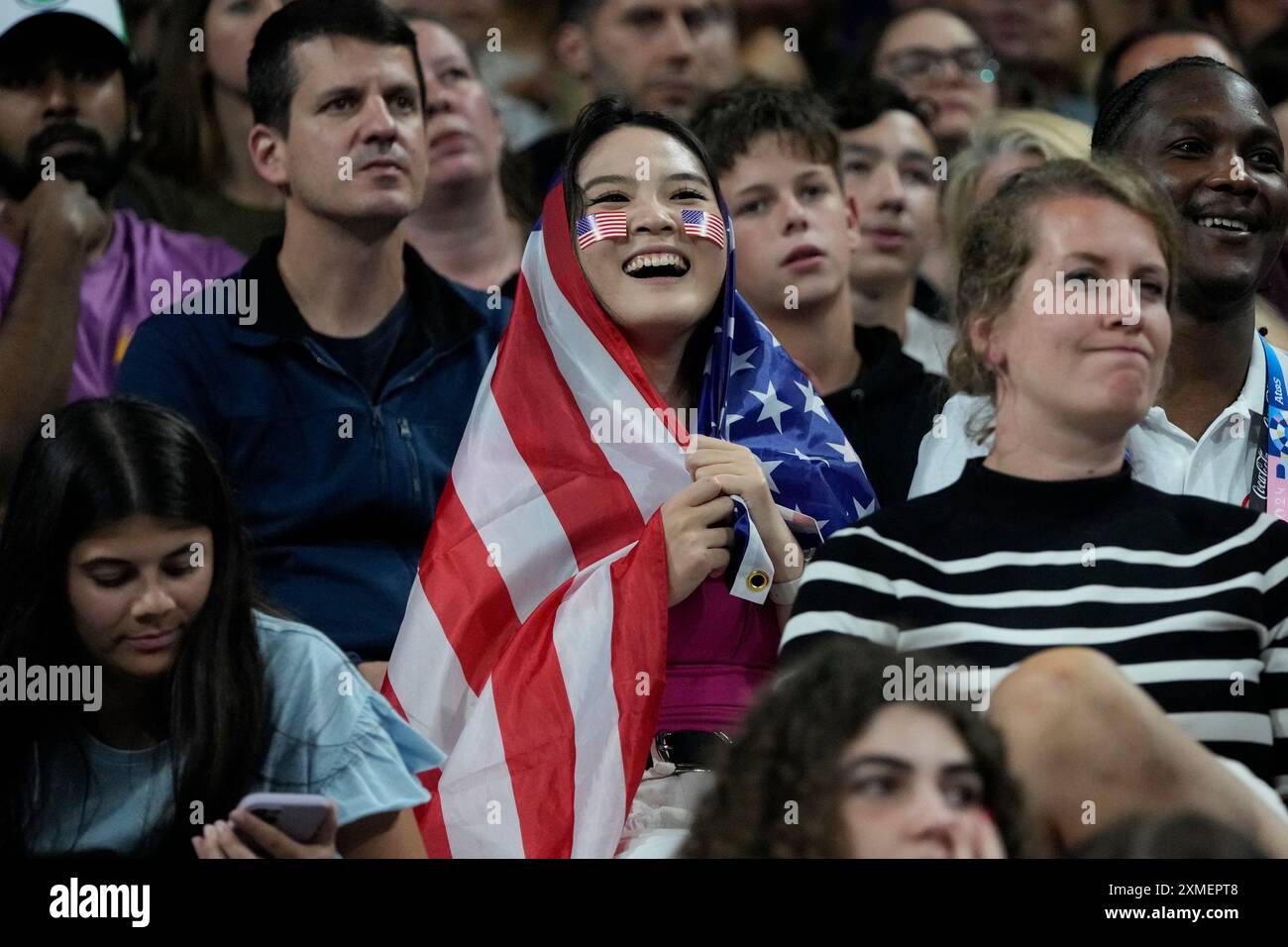 A the United States' fan cheers up her Tem during the group C ...