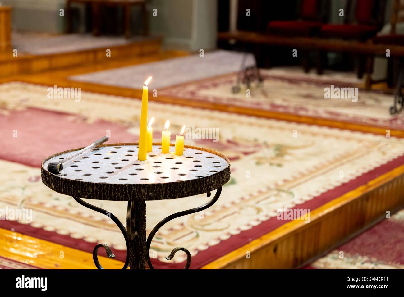 burning candles in vintage candlesticks on dark background Stock Photo ...