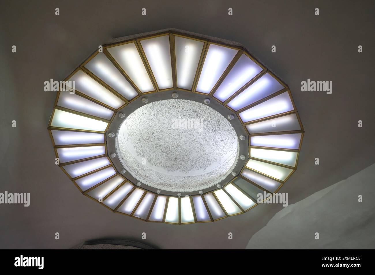Detail view of one of the large, circular, plaster carved ceiling ...