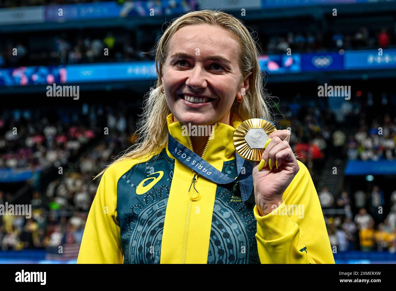 Paris, France. 27th July, 2024. Ariarne Titmus of Australia shows the gold medal after competing ...